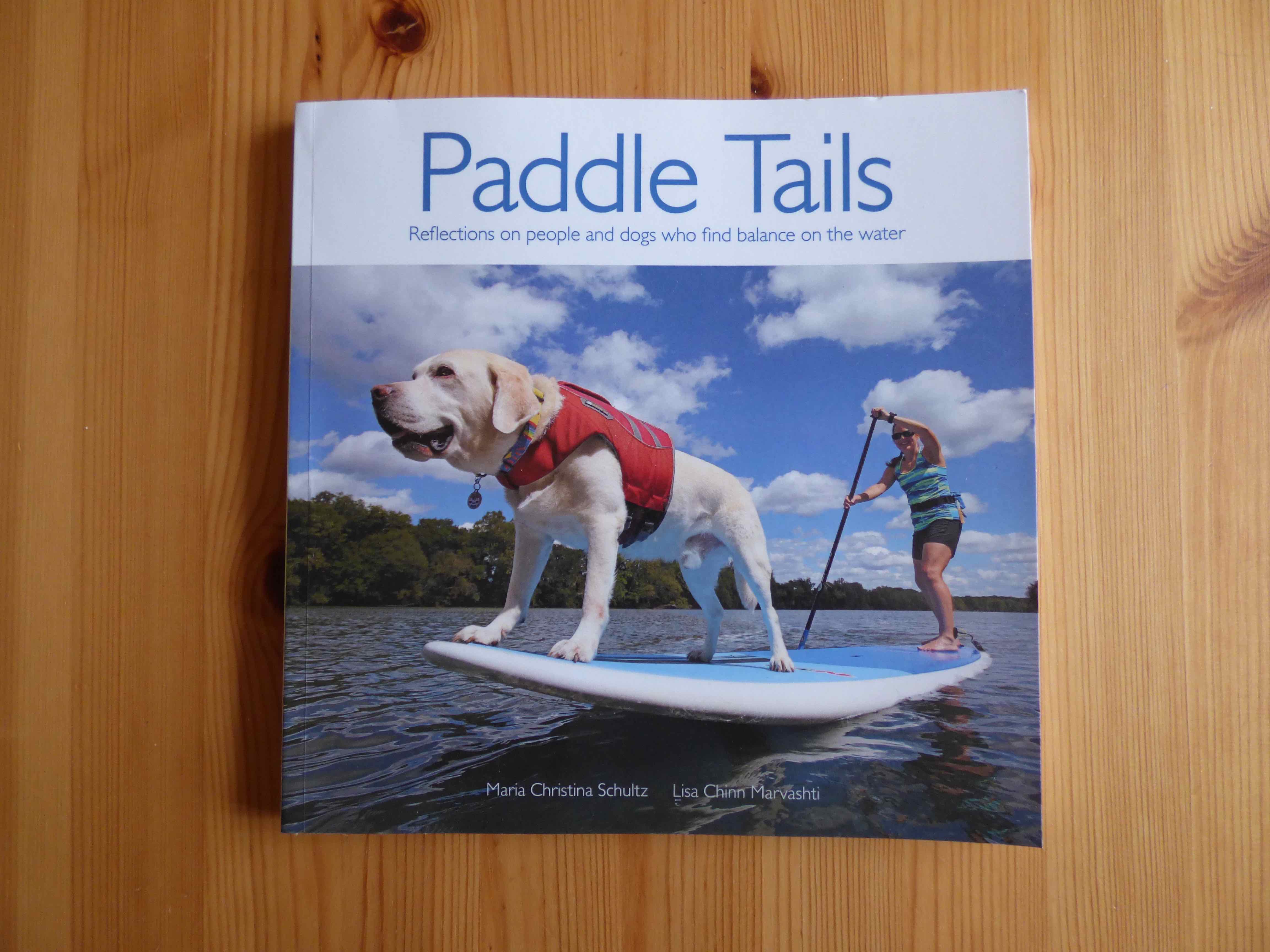 Paddle Tails book review - People and dogs balancing on water ...